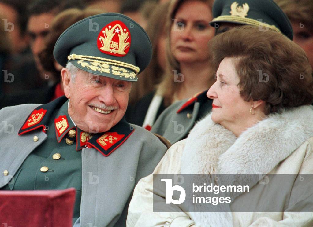 Image of General Augusto Pinochet smiles at his wife Lucia, during a