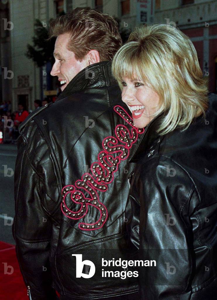 Image of Singer and actress Olivia Newton-John (R) poses with co-star Jeff