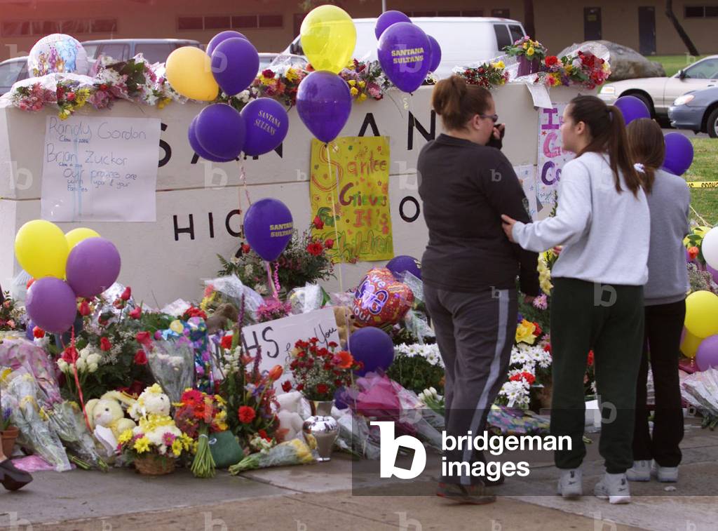 Image of Santana High School students stop to visit a memorial in