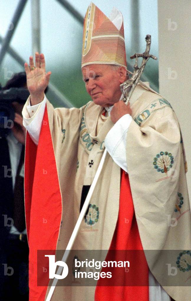 Image of Pope John Paul II waves to the crowd of some