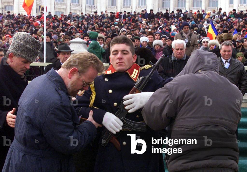 Image of A SOLDIER IS HELPED AFTER FAINTING DURING NATIONAL DAY ...