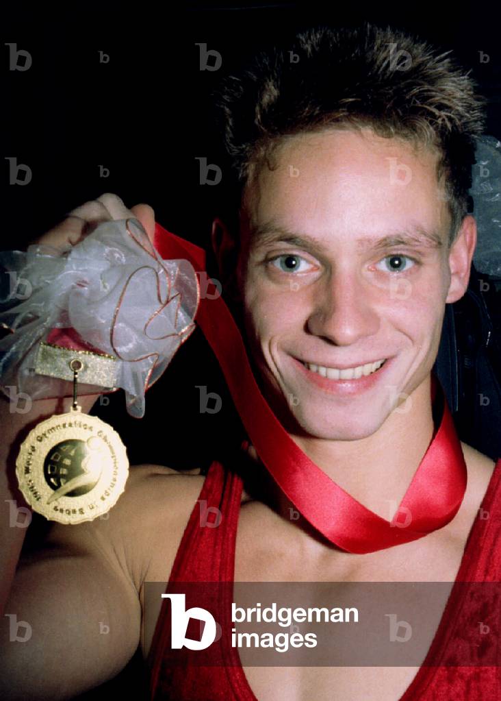 Image of Germany's Andreas Wecker is all smiles as he shows off