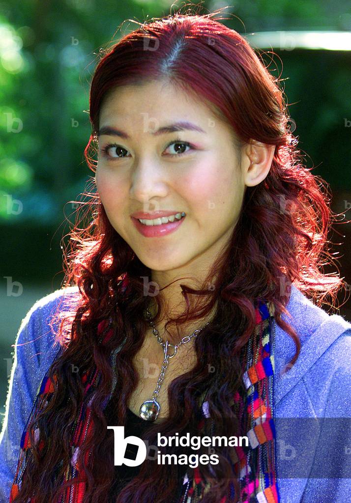 Image of Hong Kong singer-actress Rain Lee poses before the filming of