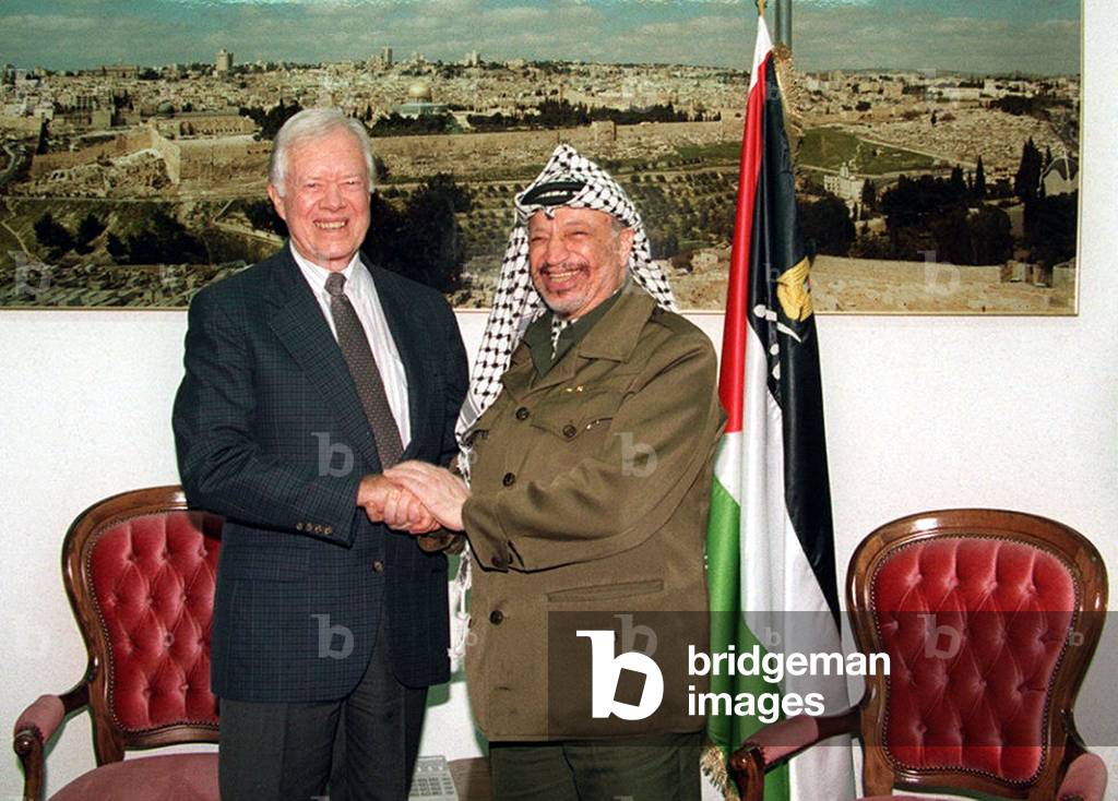 Image of Former US President Jimmy Carter (L) and Palestinian leader Yasser
