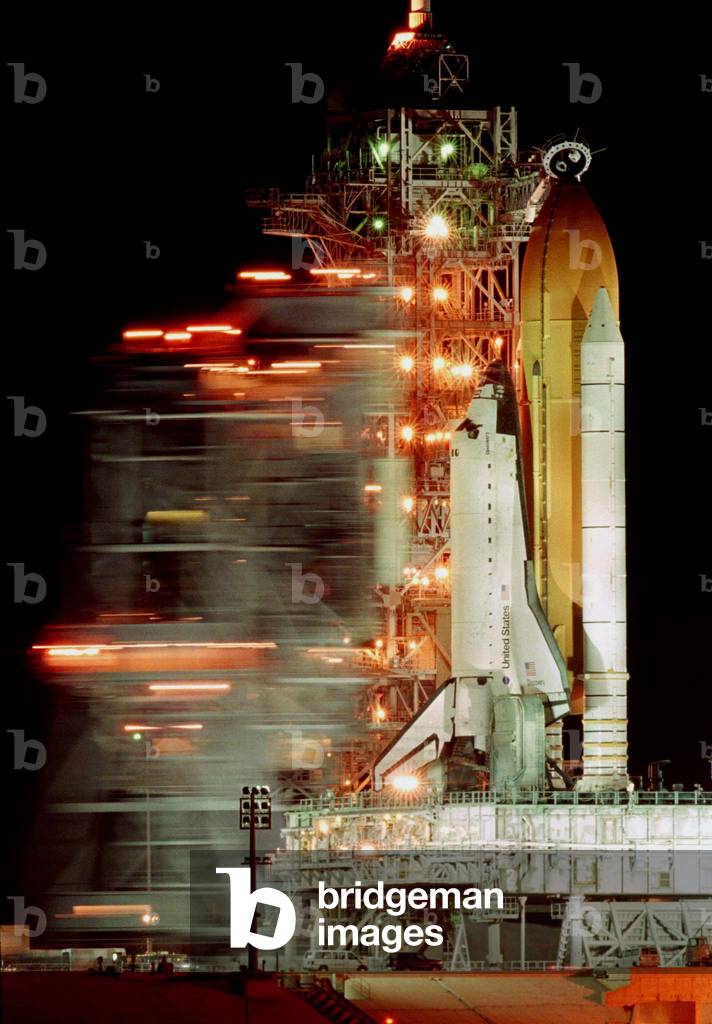 Image of The space shuttle Discovery is revealed as a time exposure