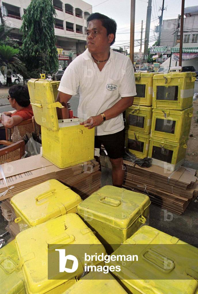 Image of ELECTION WORKER CHECKS A BALLOT BOX IN MANILA, 1998-05-10 (photo)