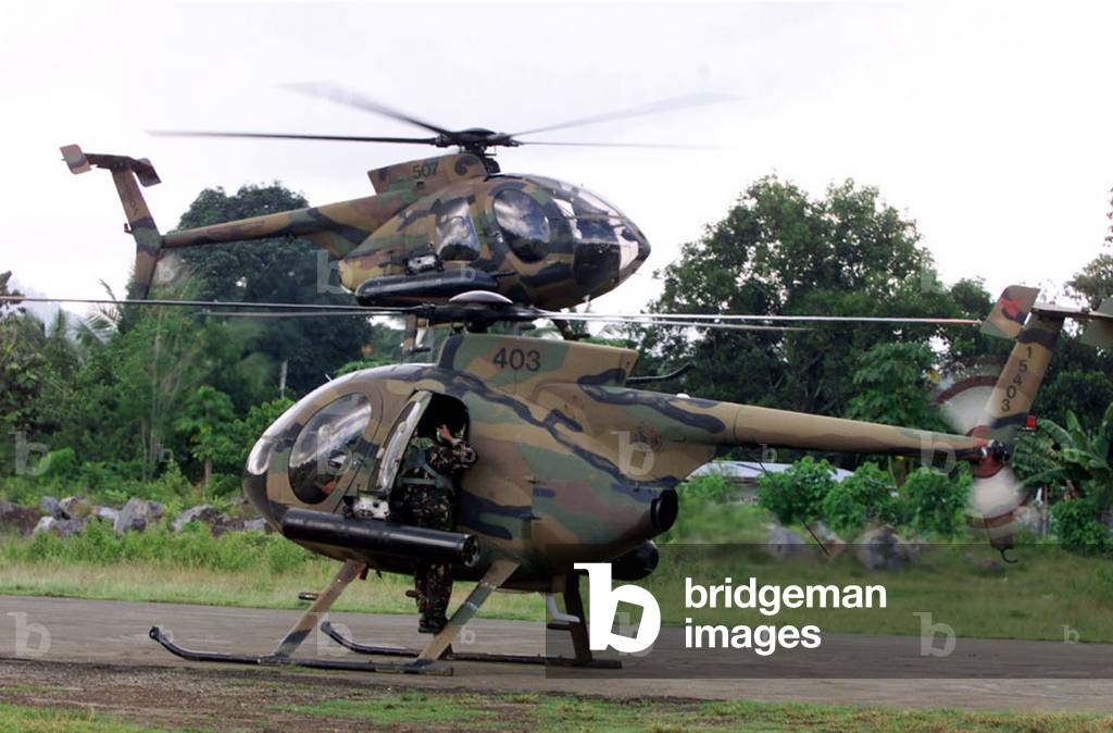 Image of PHILIPPINE AIR FORCE MG ATTACK HELICOPTERS PREPARE FOR TAKE OFF