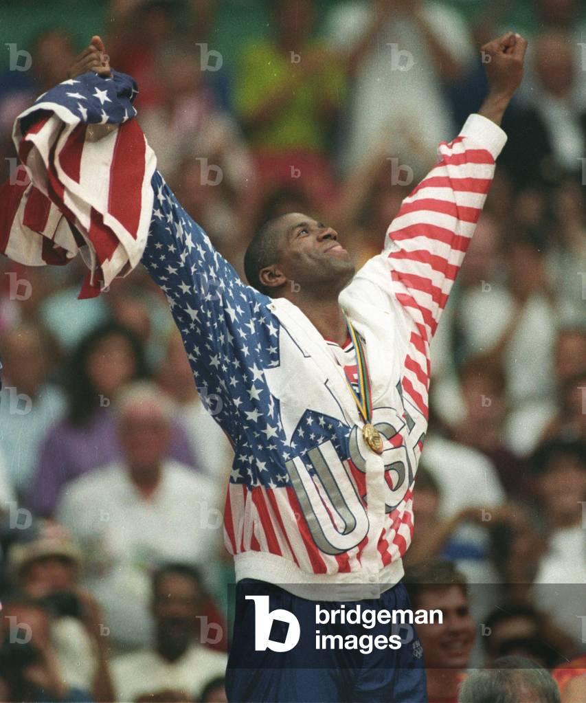 Image of MAGIC JOHNSON OF THE US WEARS HIS GOLD MEDAL AFTER
