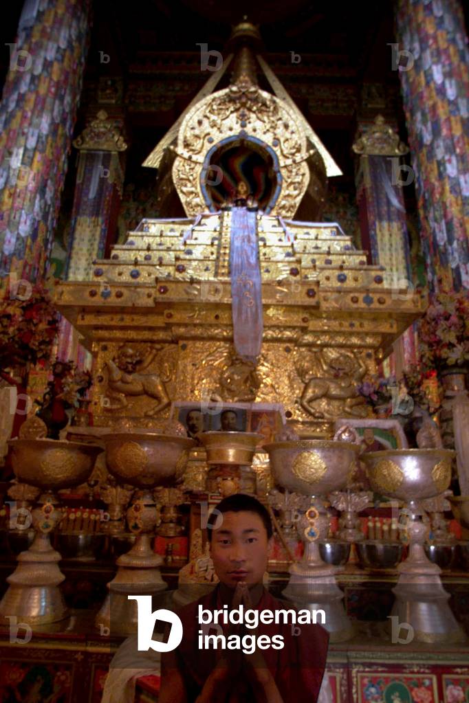 Image of TIBETAN MONK GUARDS FUNERAL STUPA OF THE 10TH PANCHEN LAMA