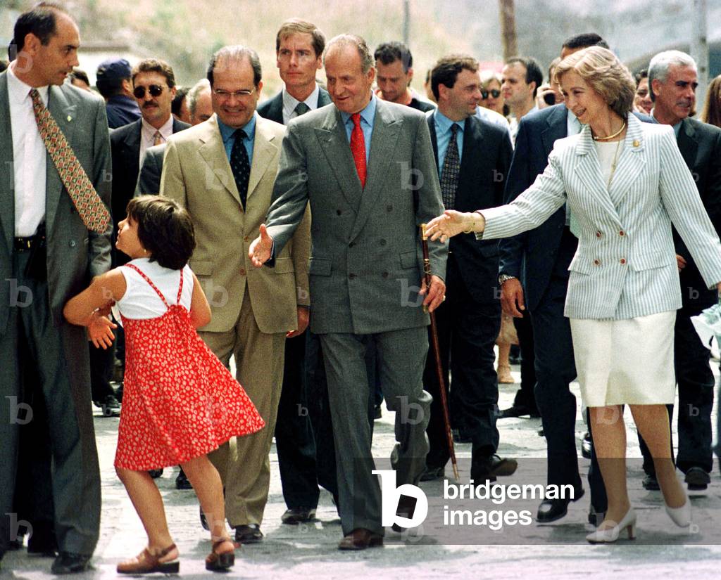 Image of A bodyguard restrains a girl who had jumped the security by ...