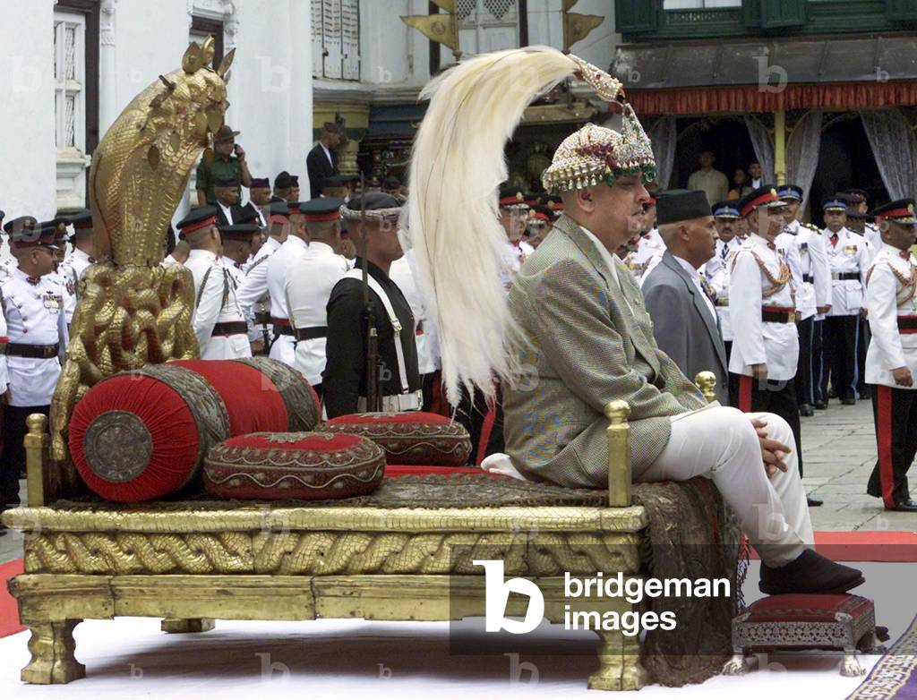 Image of NEPAL'S NEW KING GYANENDRA SITS ON THRONE AT THE HANUMAN