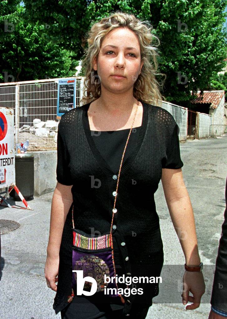 Image of Angelique Piat (C), the youngest daughter of murdered MP Yann