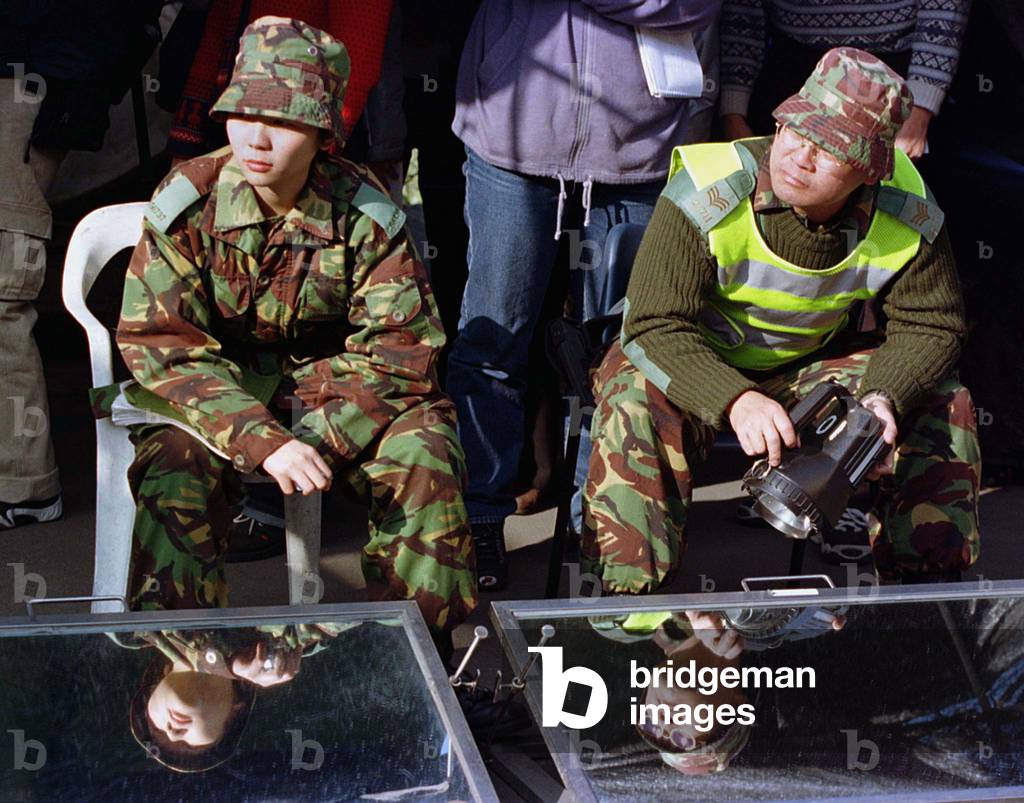Image of POLICE CHECK PASSING BY TRUCKS AT BORDER CHECKPOINT BETWEEN ...