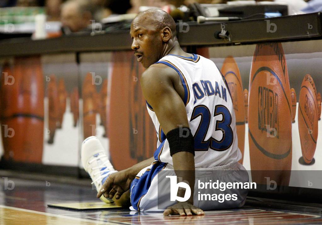 Image of Washington Wizards Michael Jordan sits on the floor waiting to