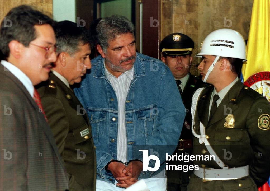 Image of Cali cartel drug lord Jose Santacruz Londono (C) is escorted