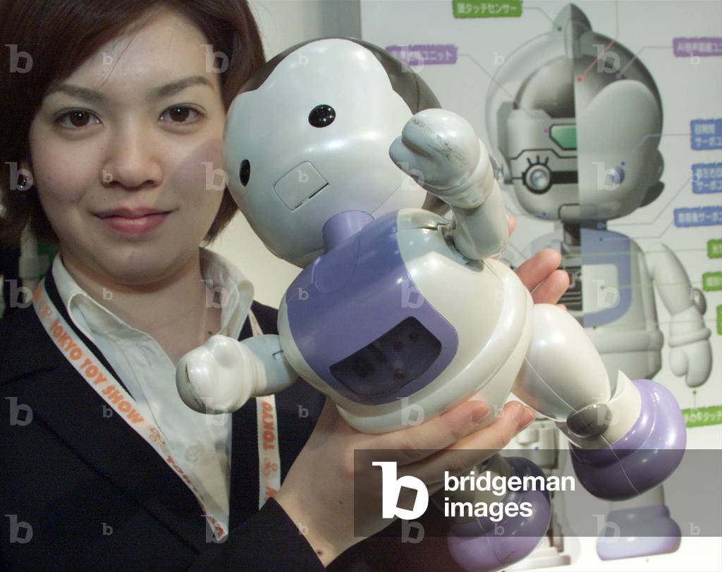 Image of Takara's Yoshiko Shoji demonstrates Baby Robot made by the ...