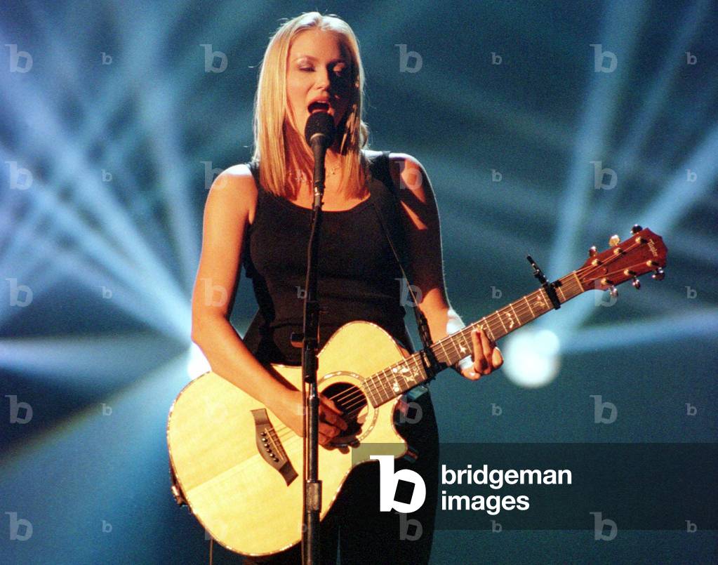 Image of Singer Jewel performs on stage at the 1997 MTV Video