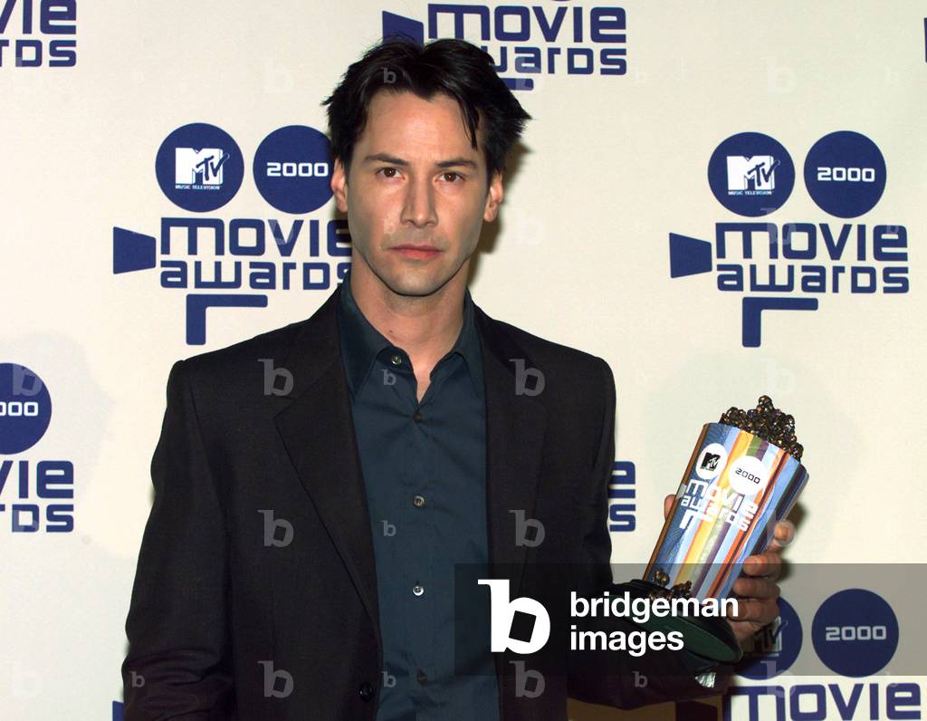 Image of Actor Keanu Reeves, star of the film "The Matrix," poses