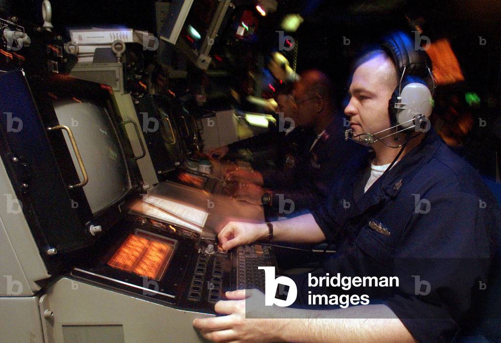 Image of FIRE CONTROL TECHNICIAN SITS AT HIS MISSILE LAUNCH CONSOLE ABOARD
