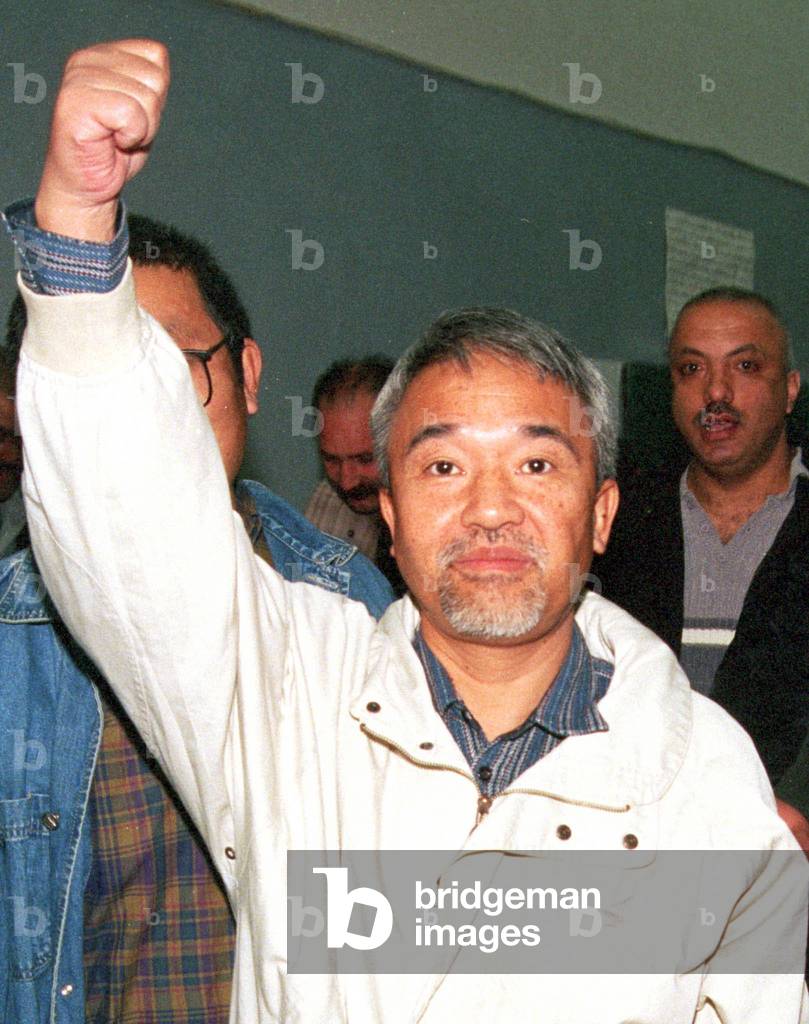 Image of Japanese Red Army guerrilla Kozo Okamoto holds up his hand