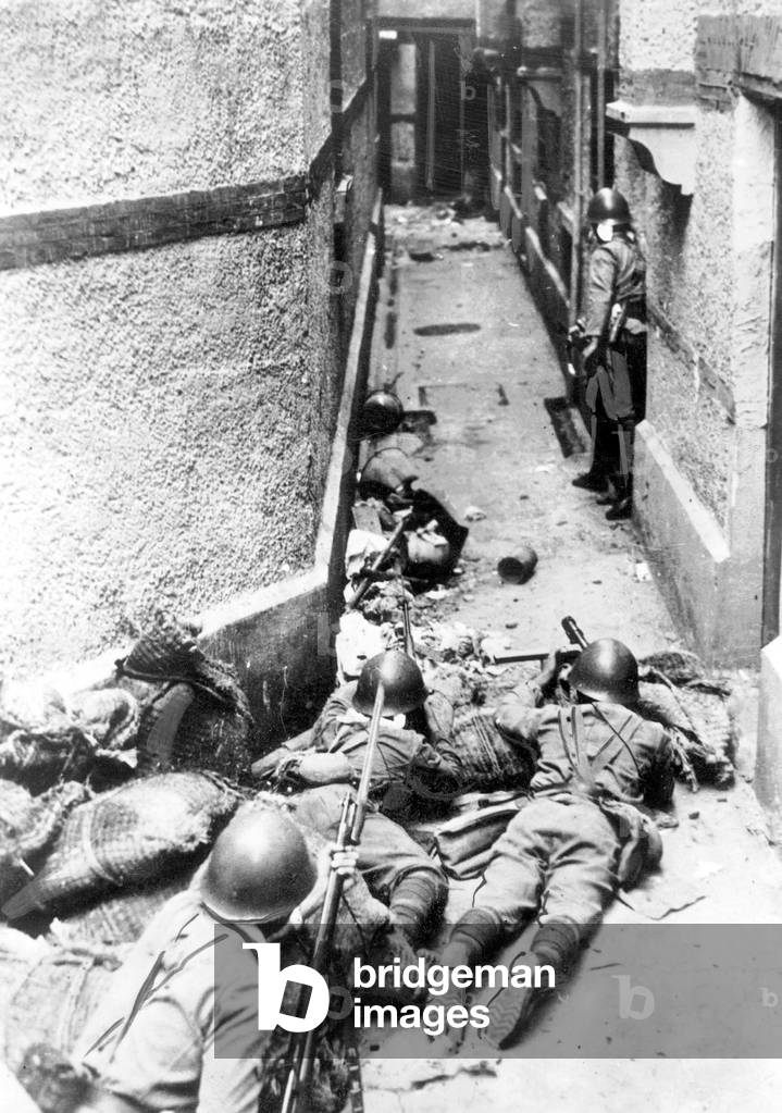Japanese machine gun firing against the British during fighting in ...