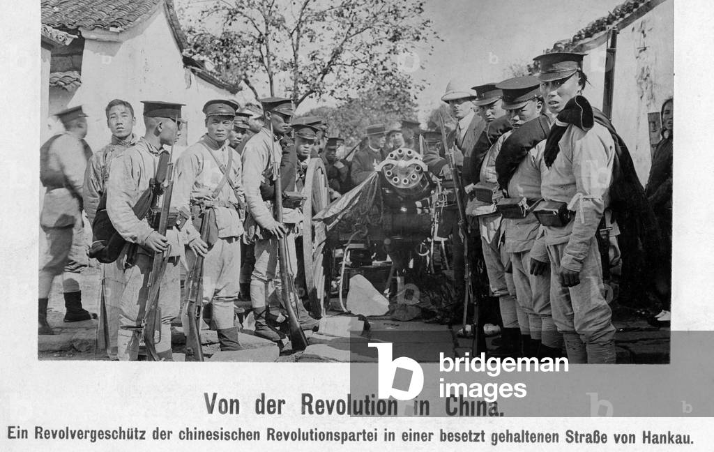 A revolver gun of Chinese revolutionary troops on an occupied street in ...