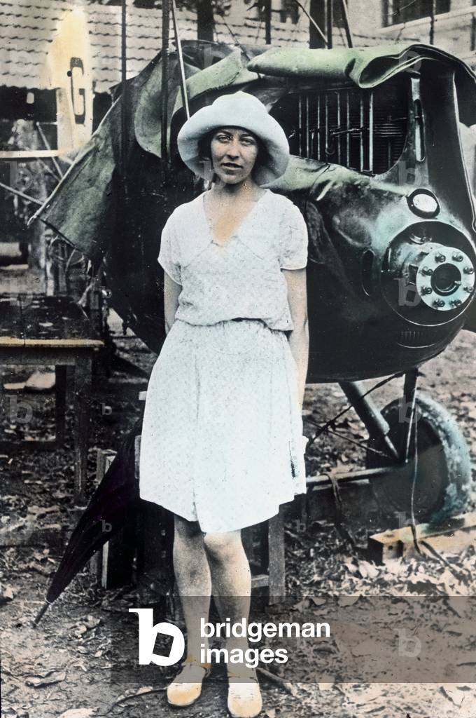 Image of Amy Johnson at Rangoon (Yangon, Rangoun) with damaged plane, Burma