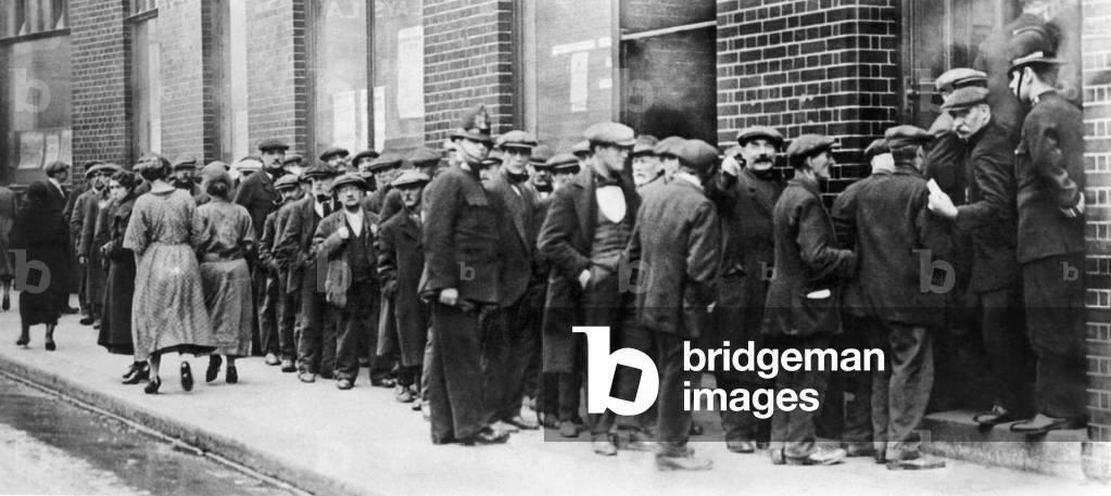 Image of London, England: c. 1923 Unemployed men in London standing in line