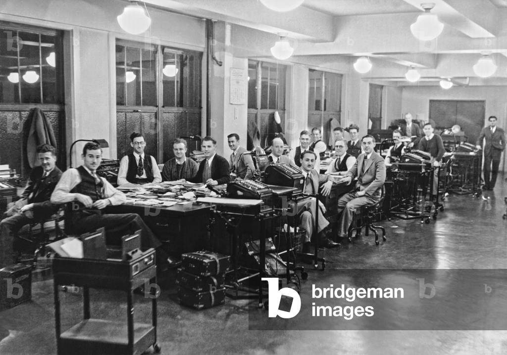 Image of United States: c. 1925 An office scene with many men and