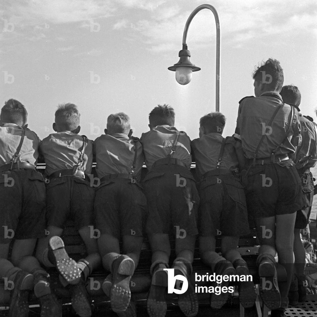 Image of The rear of seven Hitler youths at the railing of by Lämmel ...
