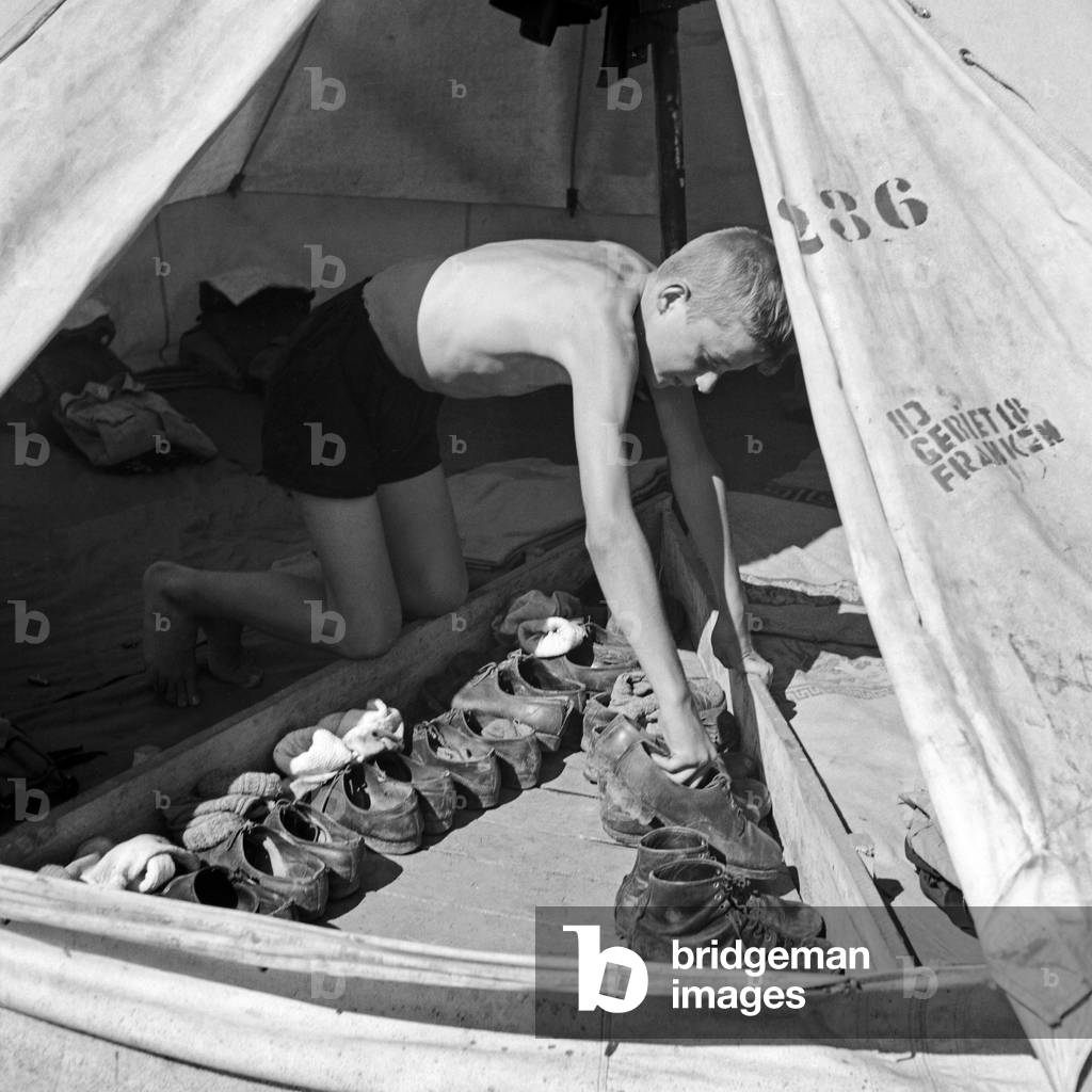 Image of At the Hitler youth camp: tent where shoes are stored,