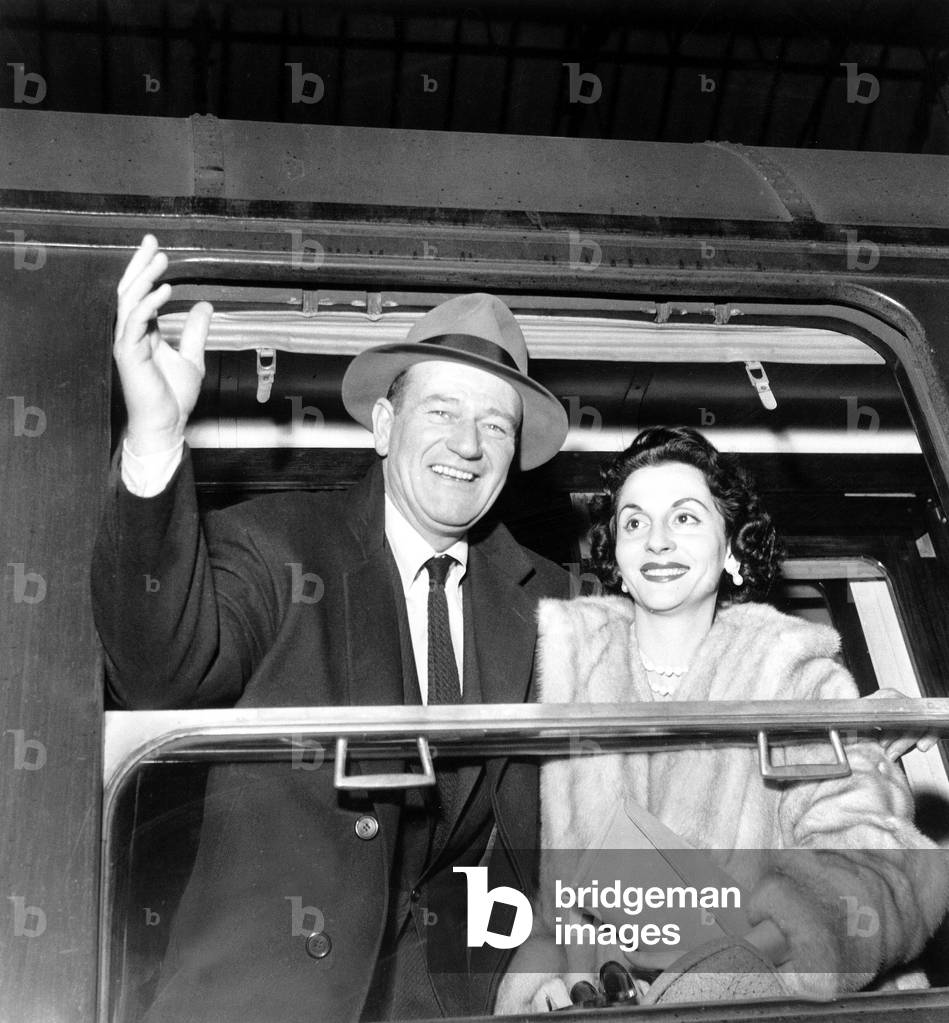 Image of John Wayne and his Wife Pilar Arriving in Paris November