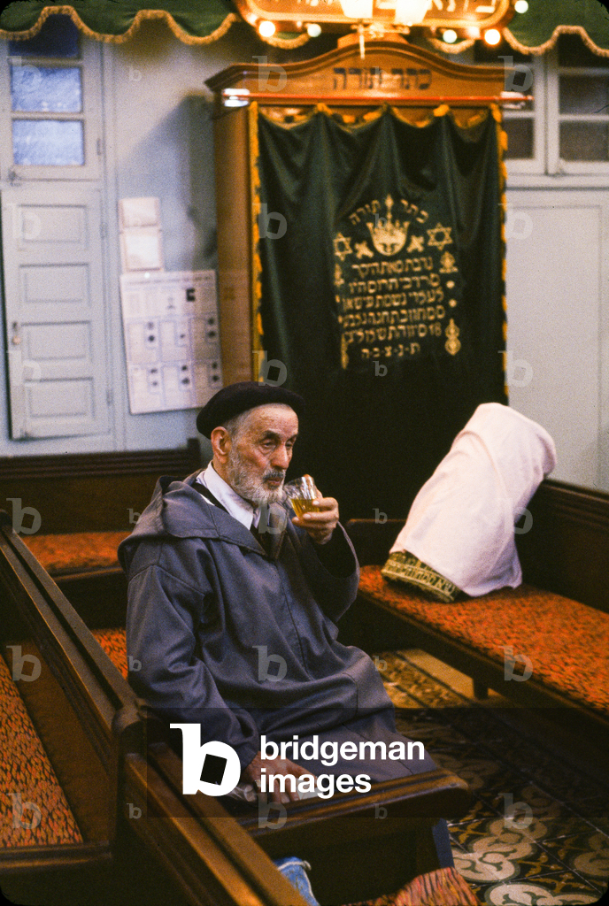 Image of Jewish men reading Hebrew prayers in a private synagogue in by ...