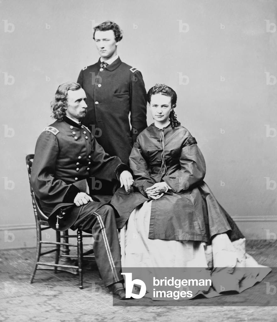 Image of George Armstrong Custer, seated with his wife Elizabeth and his