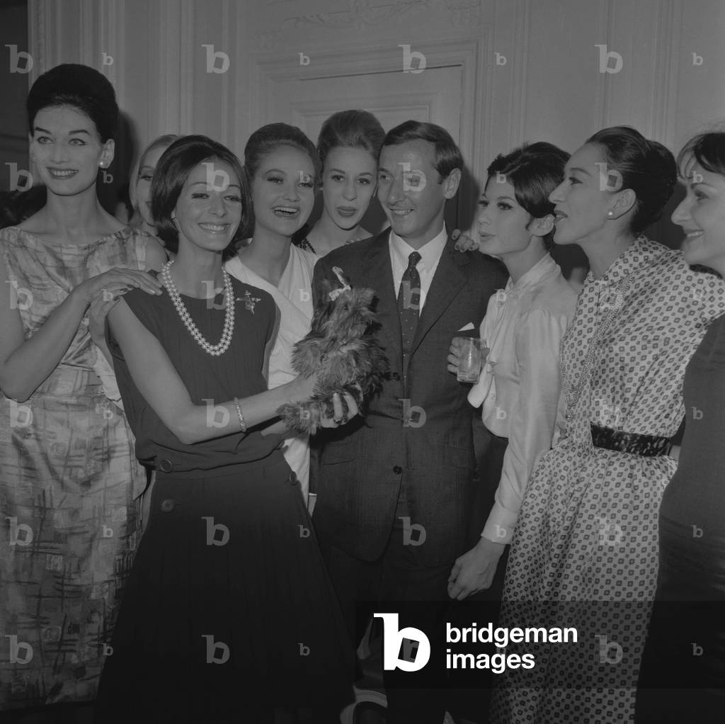 Image of Fashion deisgner Marc Bohan with his models (with the dog