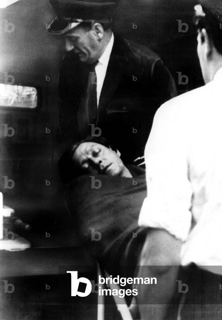 Image of Dr. Stephen Ward being carried from his home to an