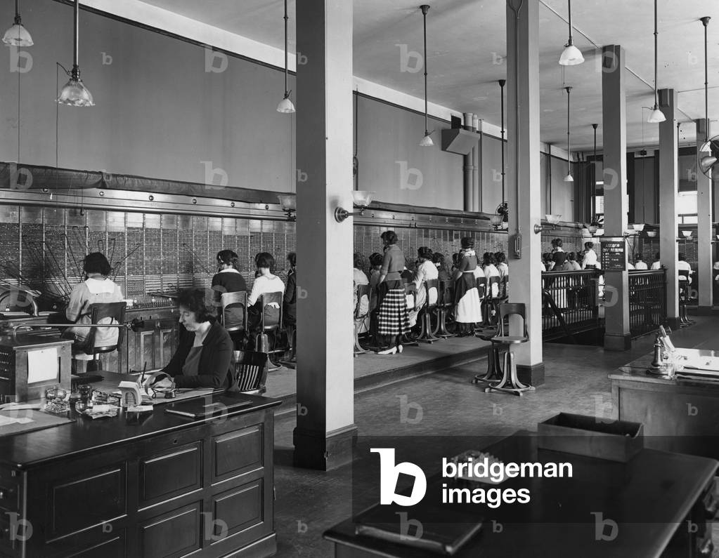 Image of Telephone operators operating switchboards by American ...