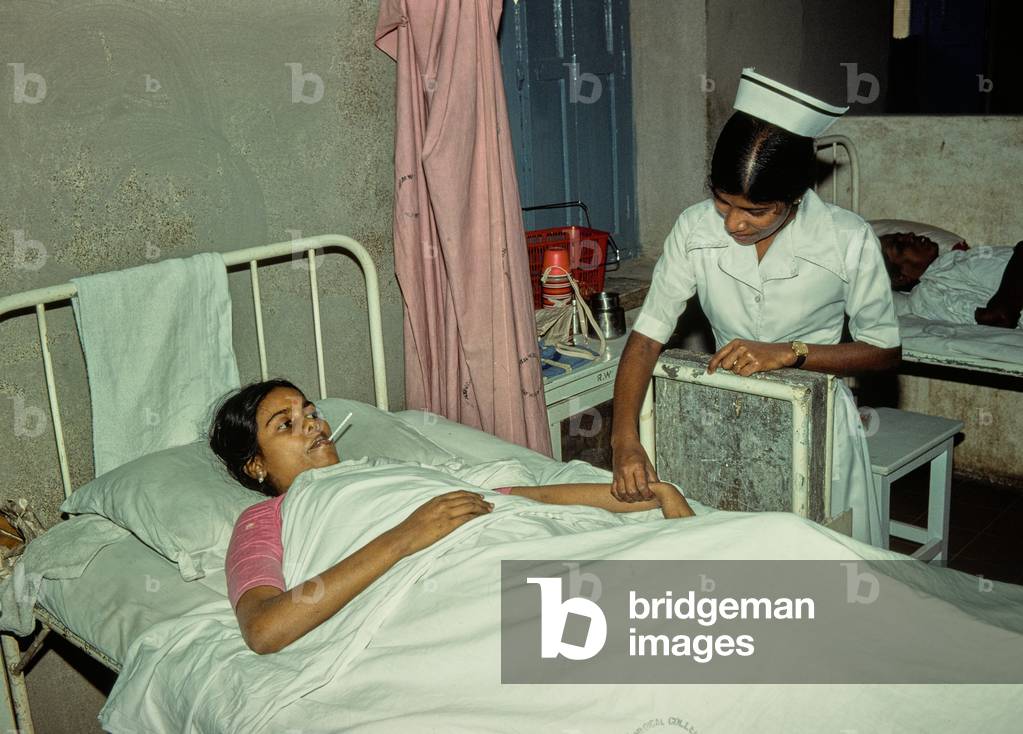 Image of Patient attended by nurse in ward at CMC Hospital, Vellore,