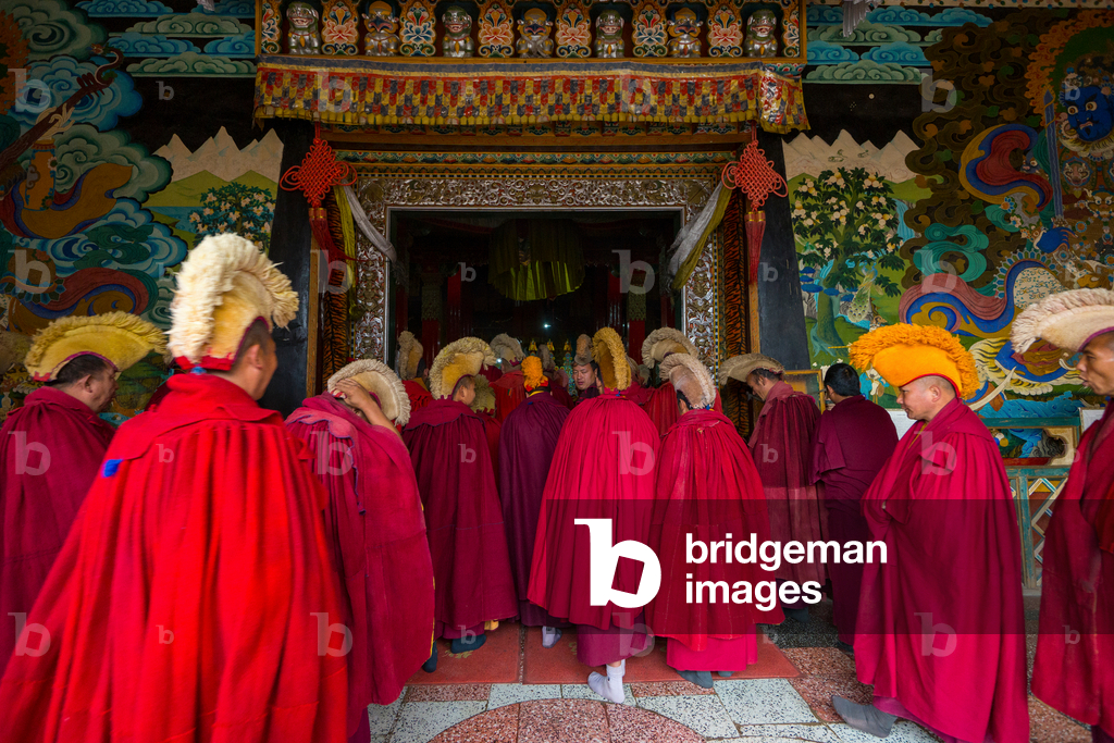 Image of Dongzhulin Monastery, monks enter the main prayer hall for ...