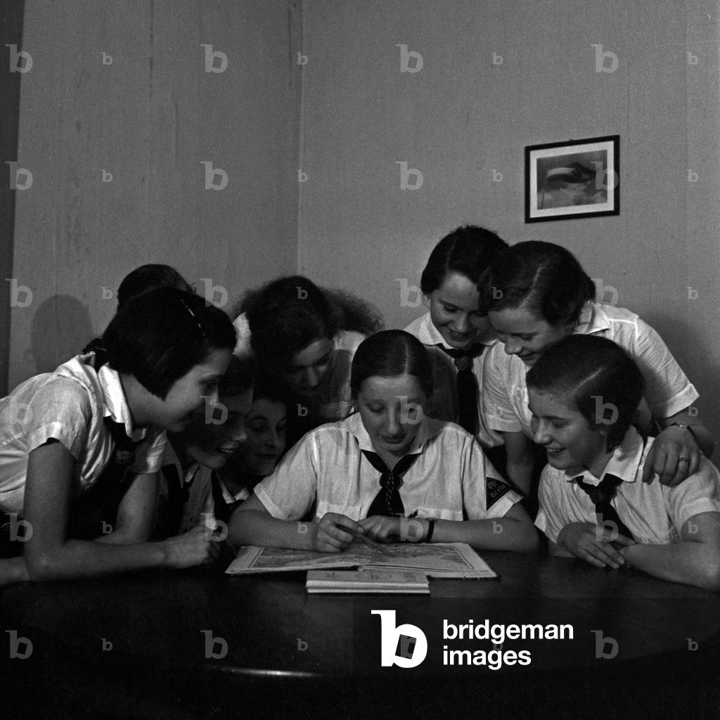 Image of A group of BdM girls studying a map at Berlin