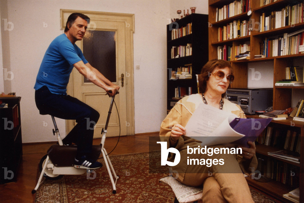 Image of Actor Helmut Fischer on a home trainer with wife Utta