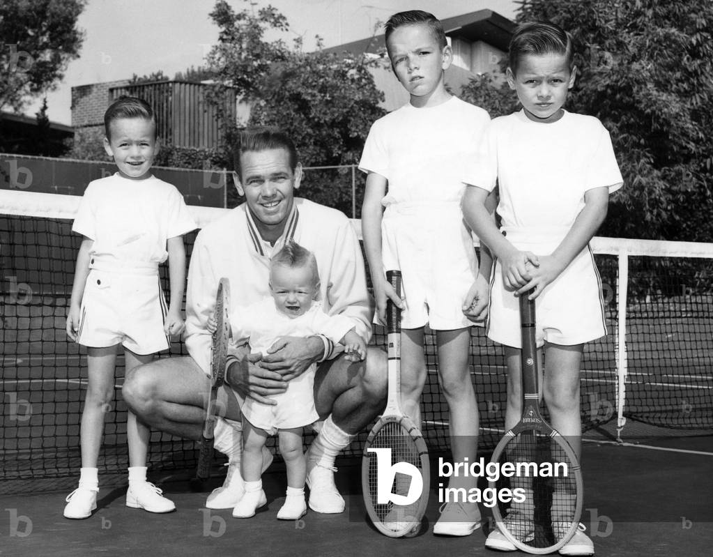 Image of Jack Kramer (second from left) at home with his sons