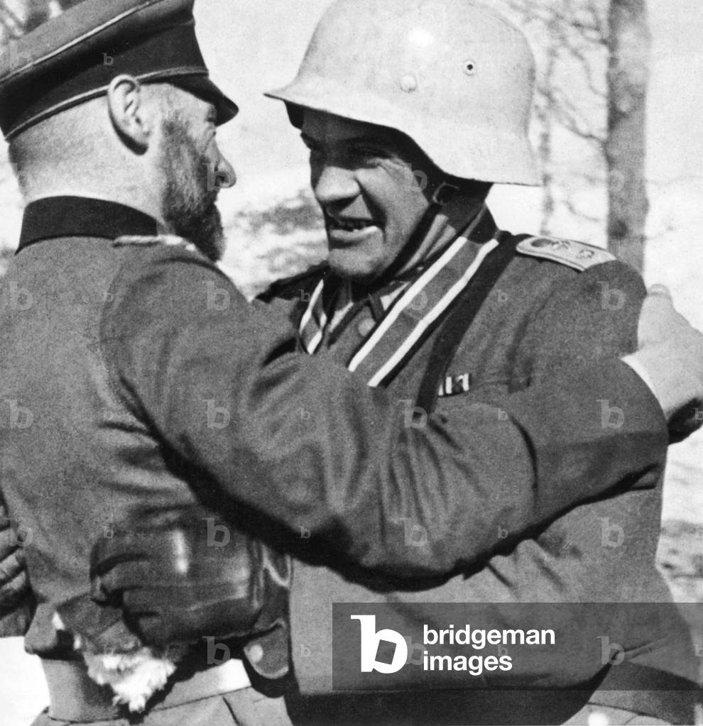 Image of German nazi captain Biecker and major Scherer during decorating of