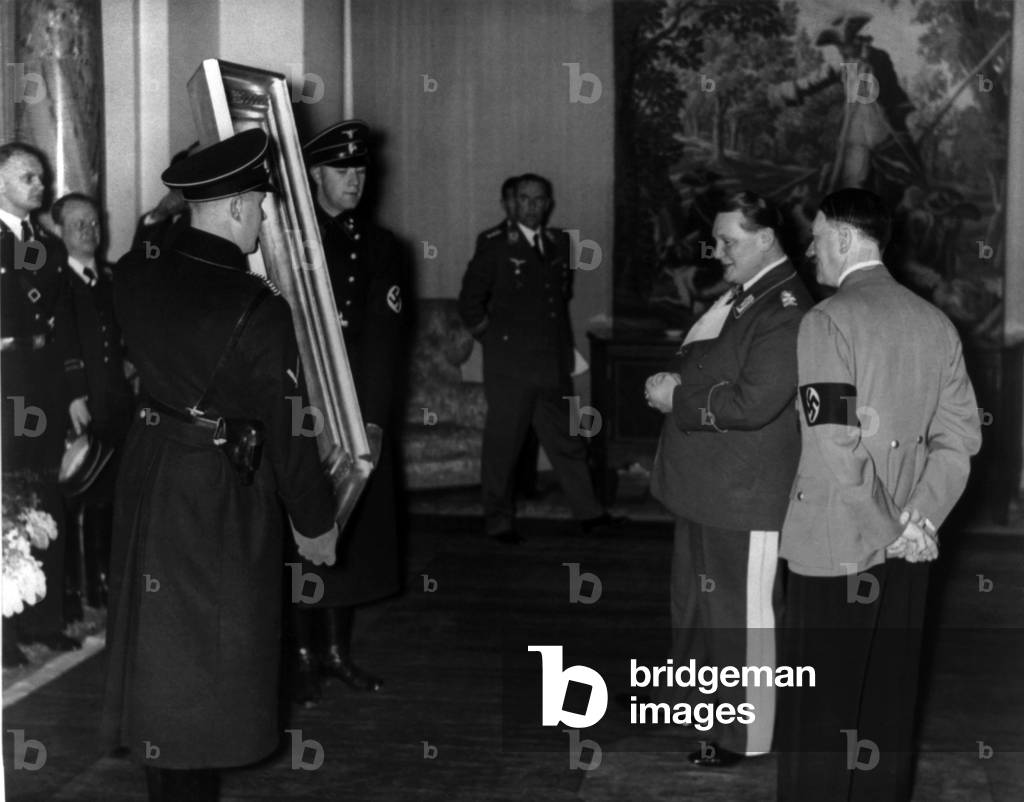 Hermann Goering shows a confiscated painting to German Leader Adolf ...