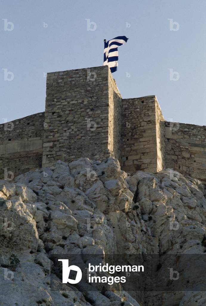 Image of The Greek flag waving on the walls of the Acropolis