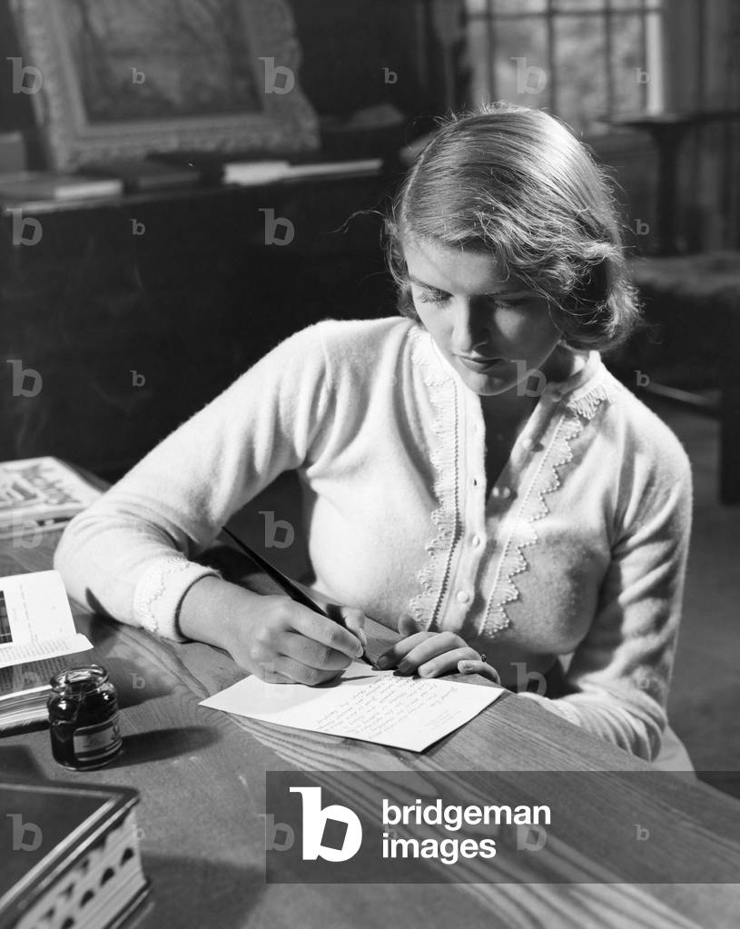 Image of Teenage girl writing a letter
