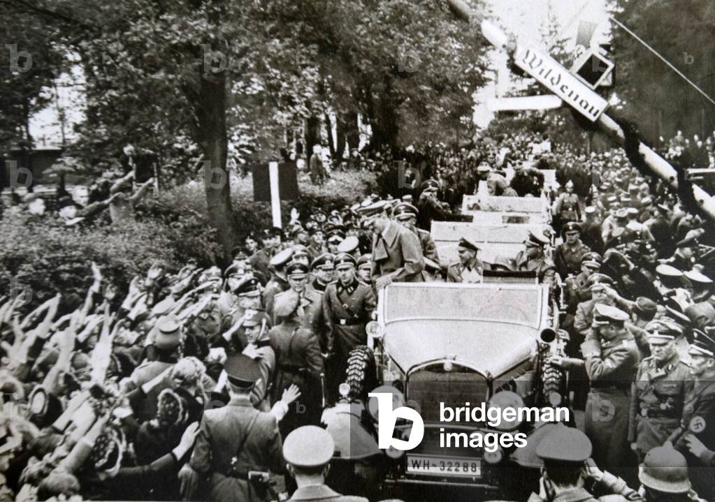 Image of Adolf Hitler driving through crowds in Wildenau