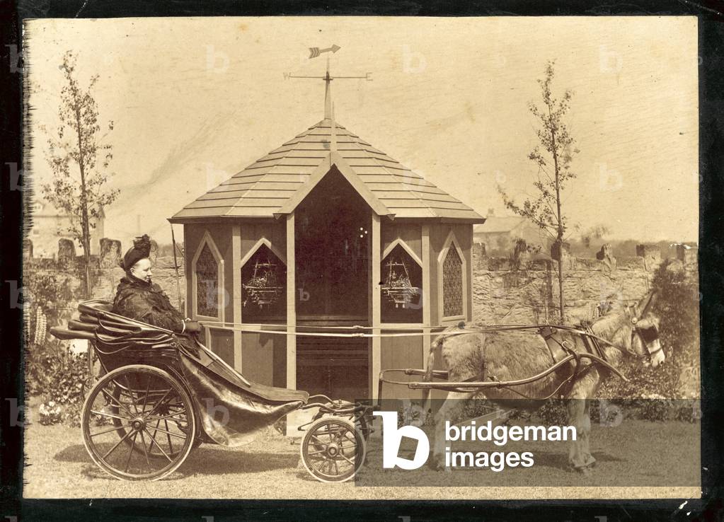 Image of Woman in a donkey carriage with a gazebo (b/w photo) by ...