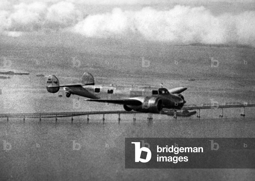 Image of Amelia Earhart's plane over San Francisco Bay, 1937 (b/w photo)