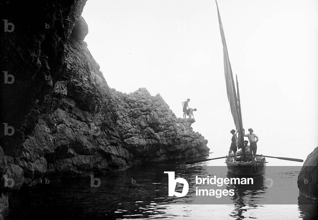 Image of Bathers on board a sailing boat in a cave on